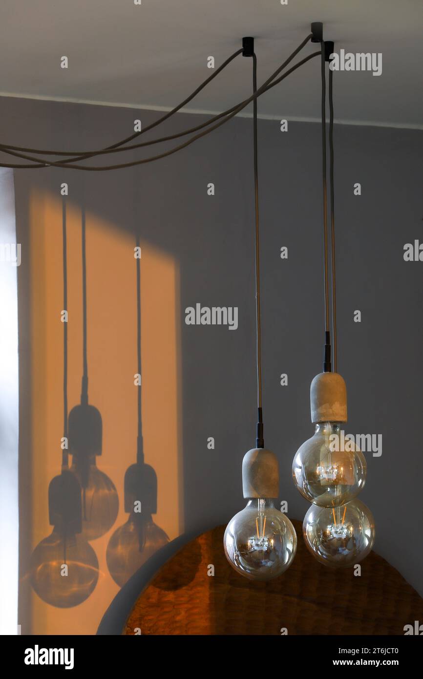 Modern interior lights. Minimalist house design. Three lightbulbs next ...