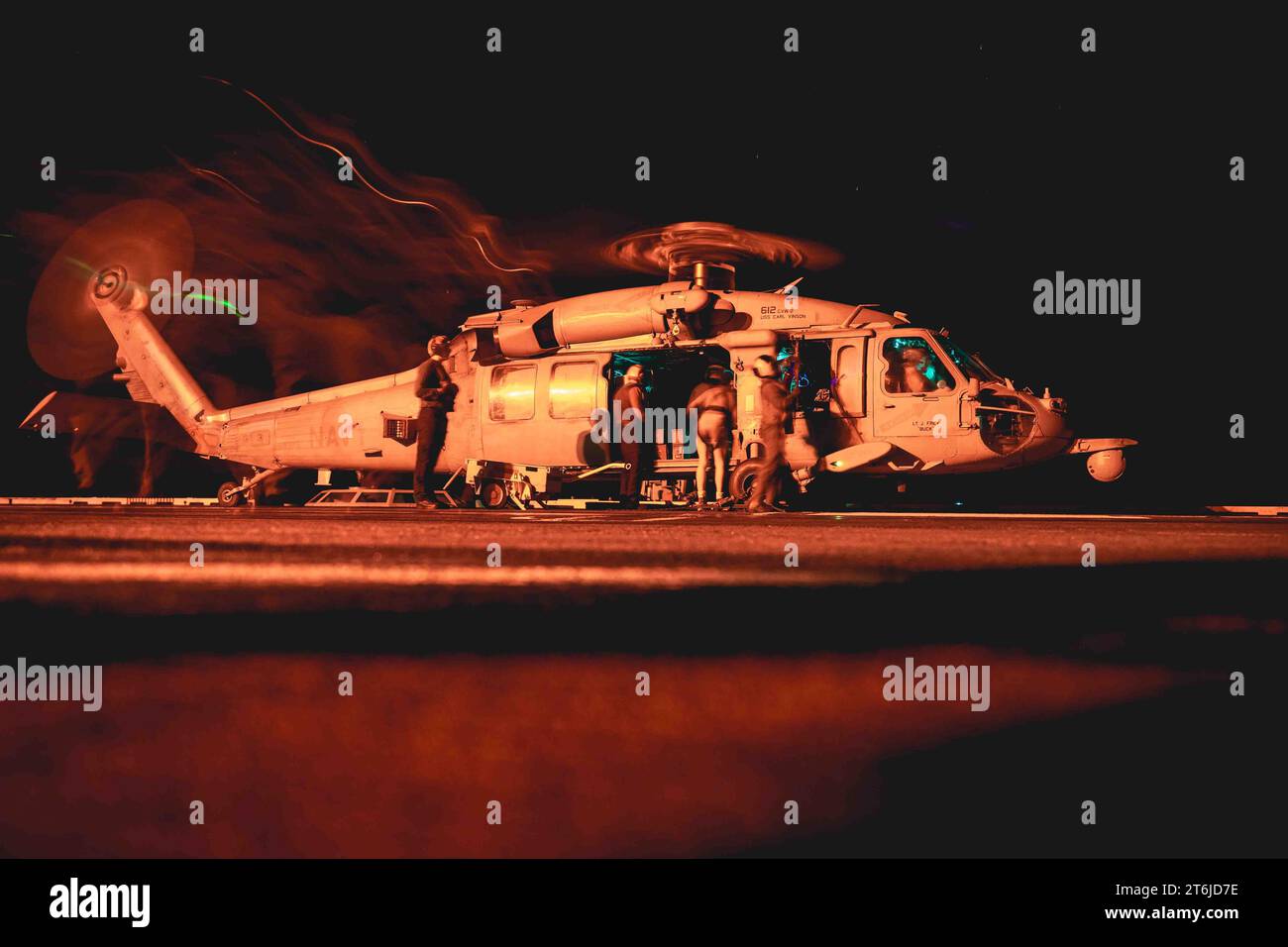 Sailors conducted post-flight checks on an MH-60S Sea Hawk helicopter ...