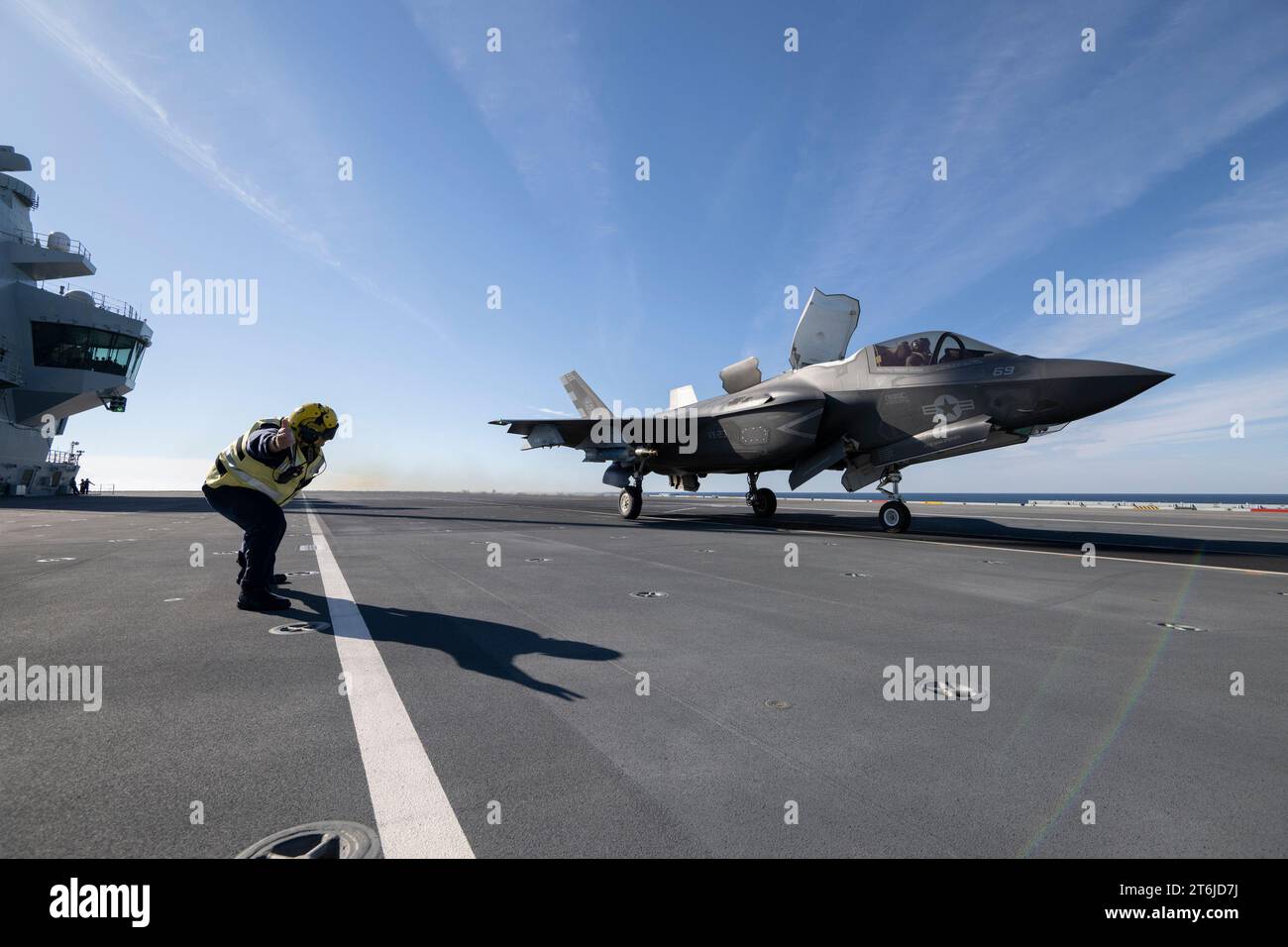 Aircraft handler aboard the Royal Navy aircraft carrier HMS Prince of ...