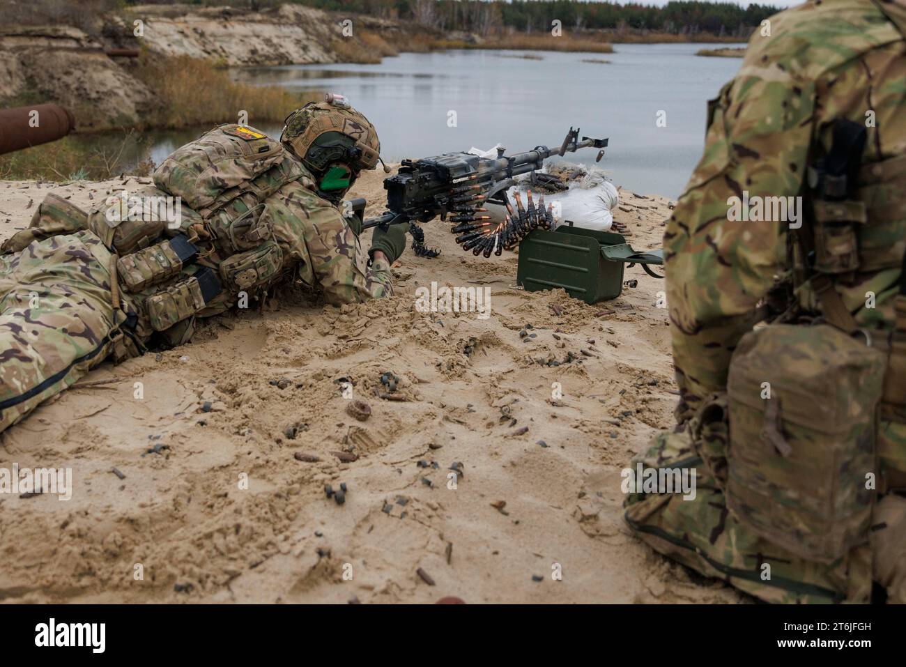 Soldiers of the Azov Brigade practice with a captured Russian 12.7 Kord ...