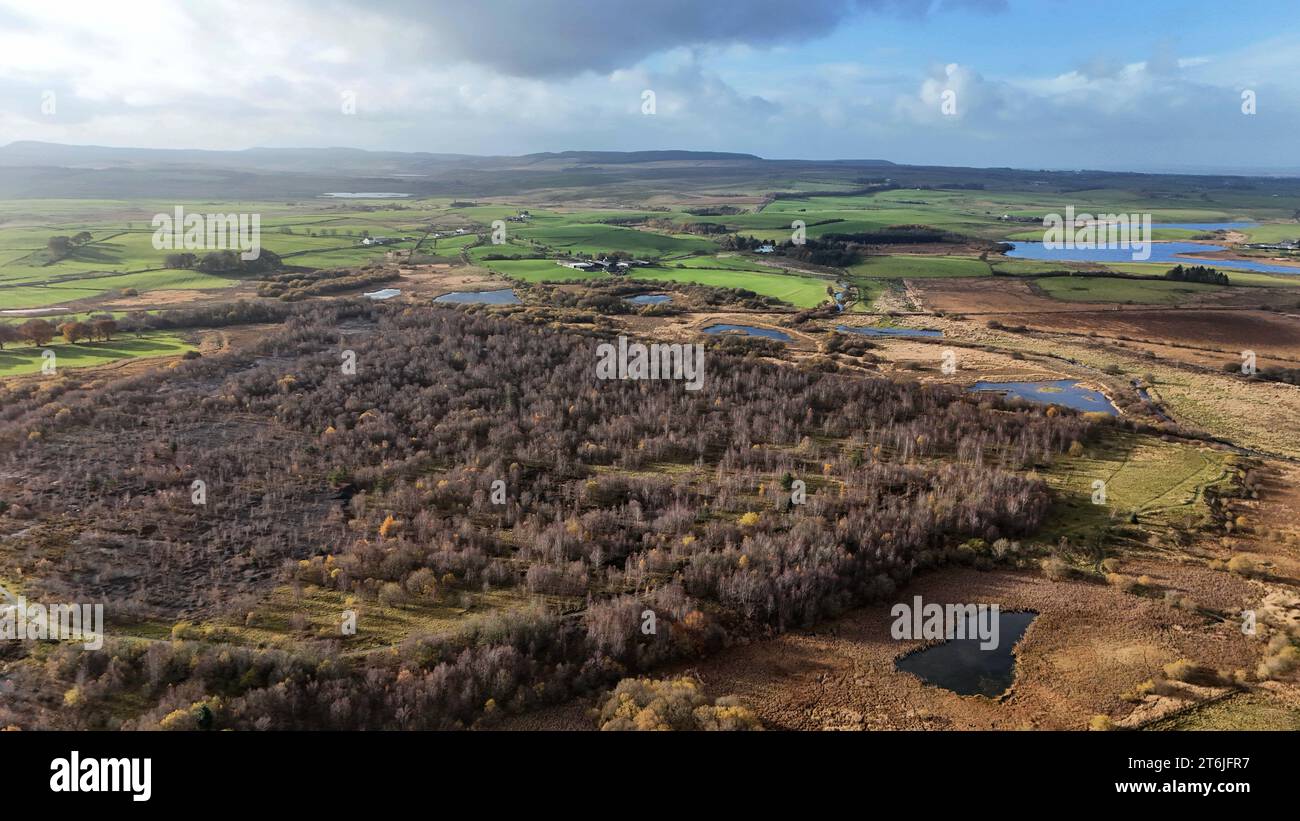 An aerial view of a rural countryside under a bright sky in New Cumnock ...