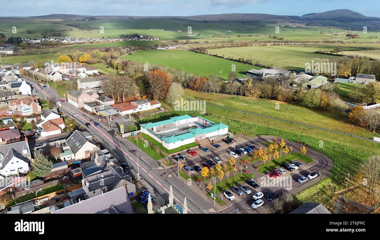 An aerial view of a rural countryside under a bright sky in New Cumnock ...