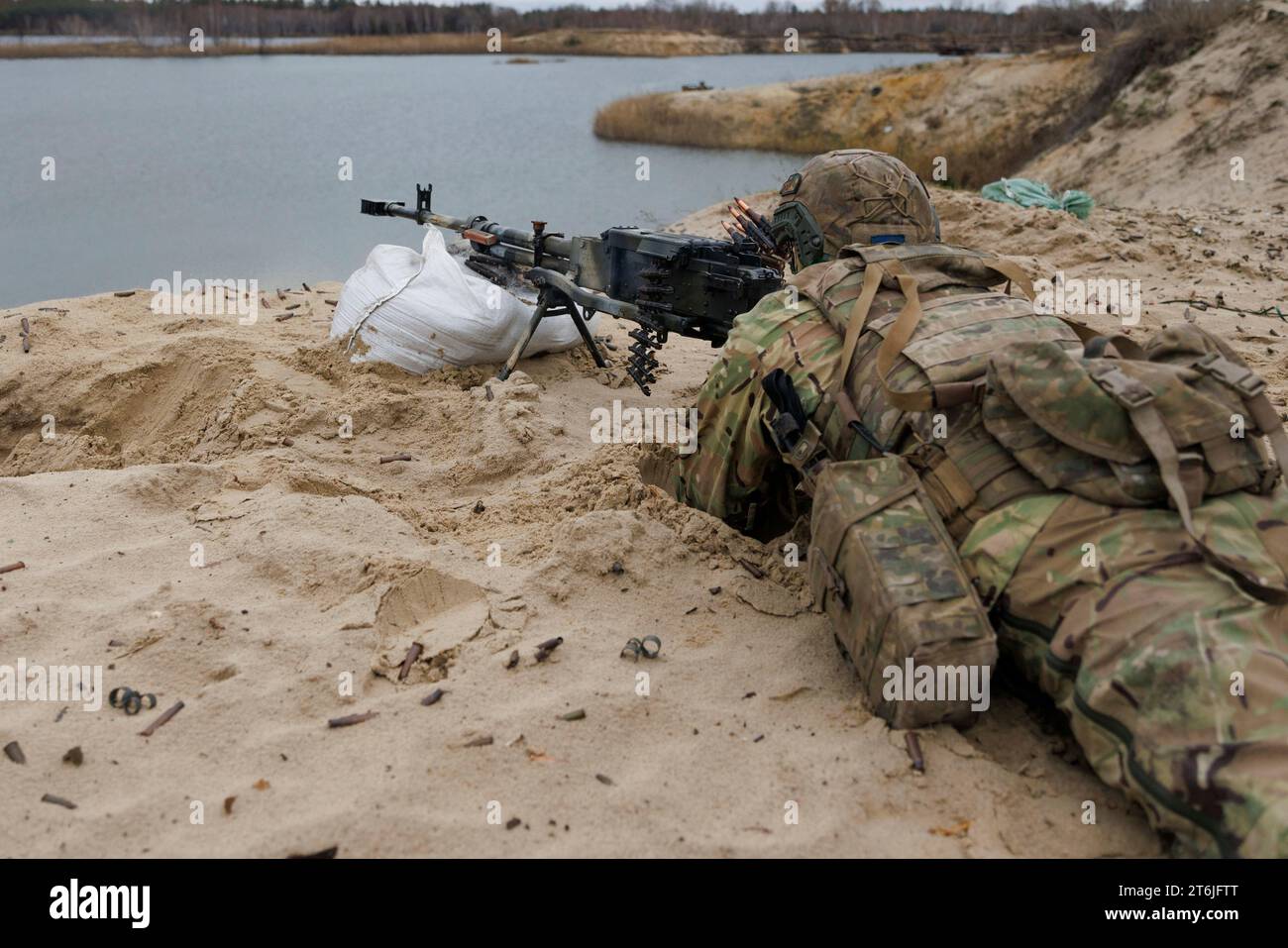 Soldiers of the Azov Brigade practice with a captured Russian 12.7 Kord ...
