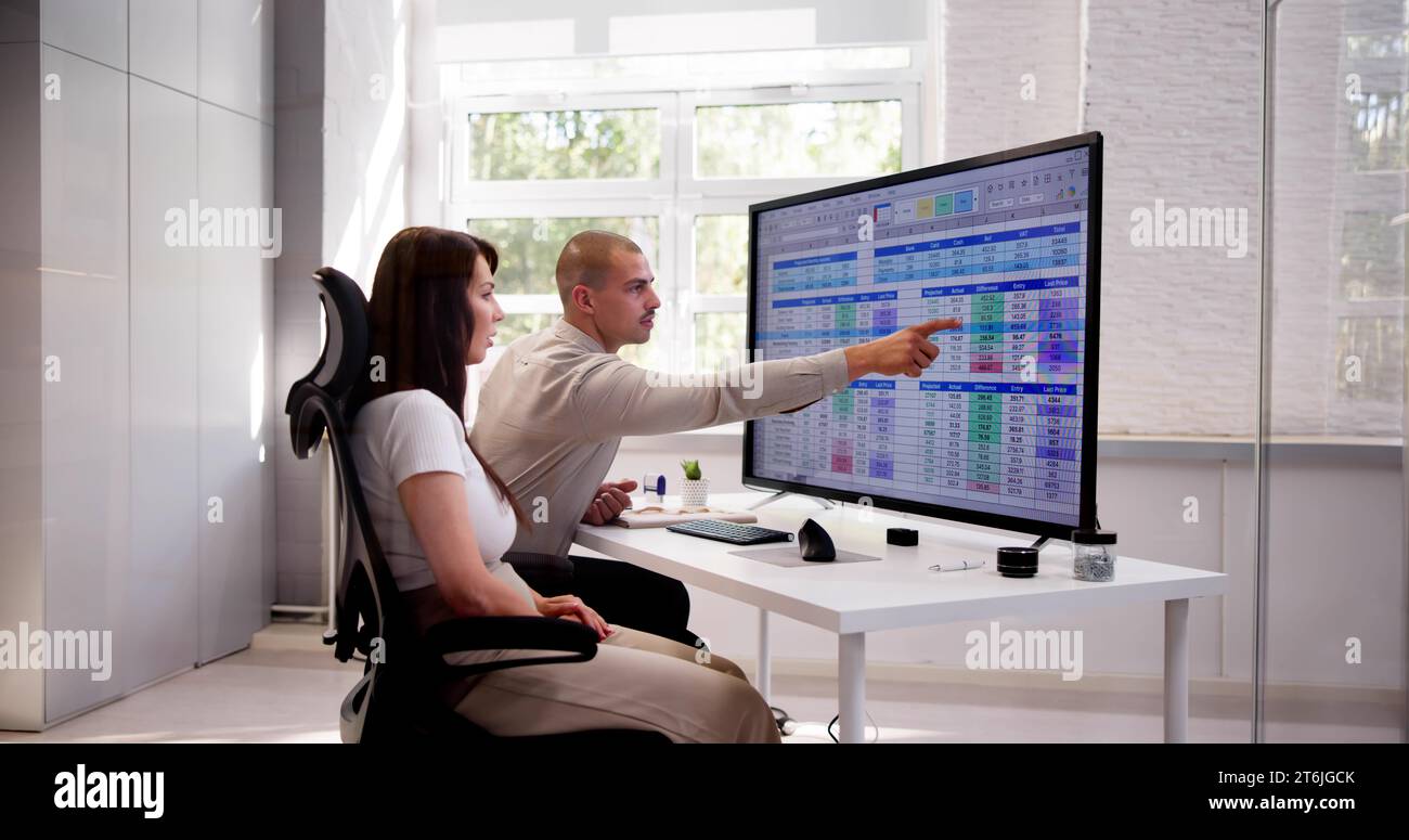 Analyst Employee Working On Spreadsheet Using Desktop Computer Stock ...