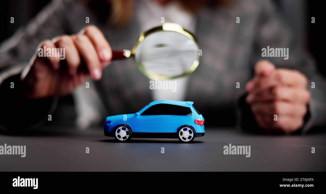 Hand Repair Using a Magnifying Glass and Magnifier Stock Photo - Alamy