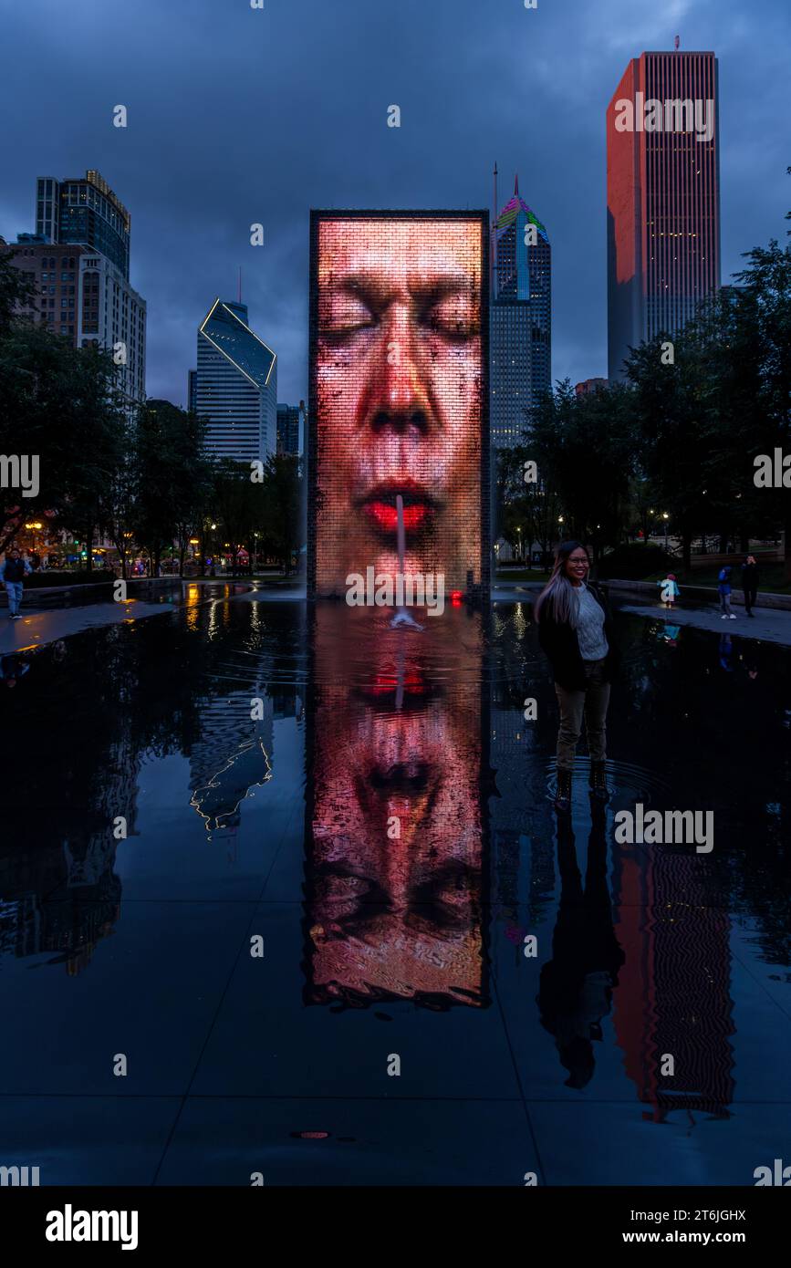 The Crown Fountain is a public sculpture with 2 50-ft. LED towers & a reflecting pool, by ...