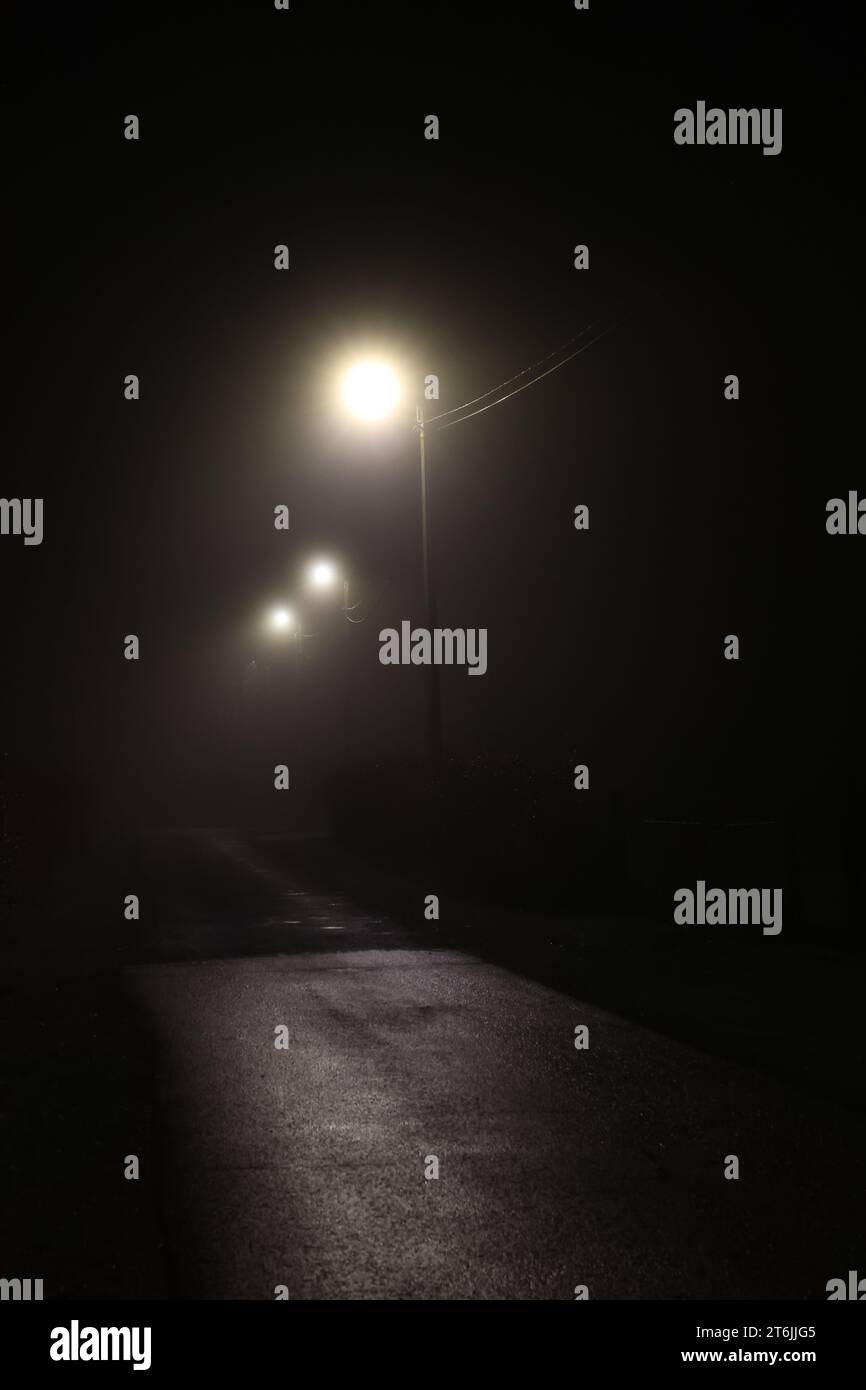 Empty night street with fog and lights Stock Photo - Alamy