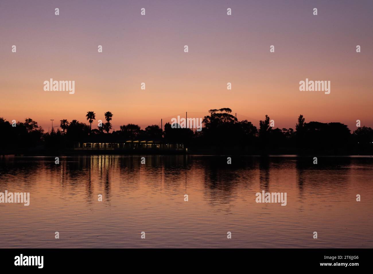 Sunset by the lake Stock Photo - Alamy