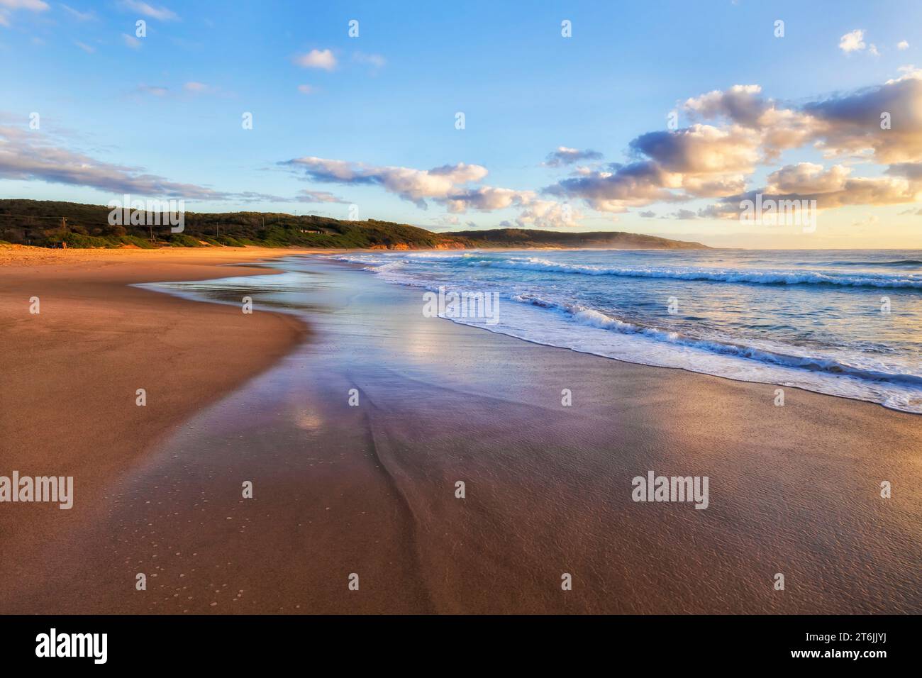 Flat sunlit Middle camp beach at Catherine hill bay town on Pacific ...