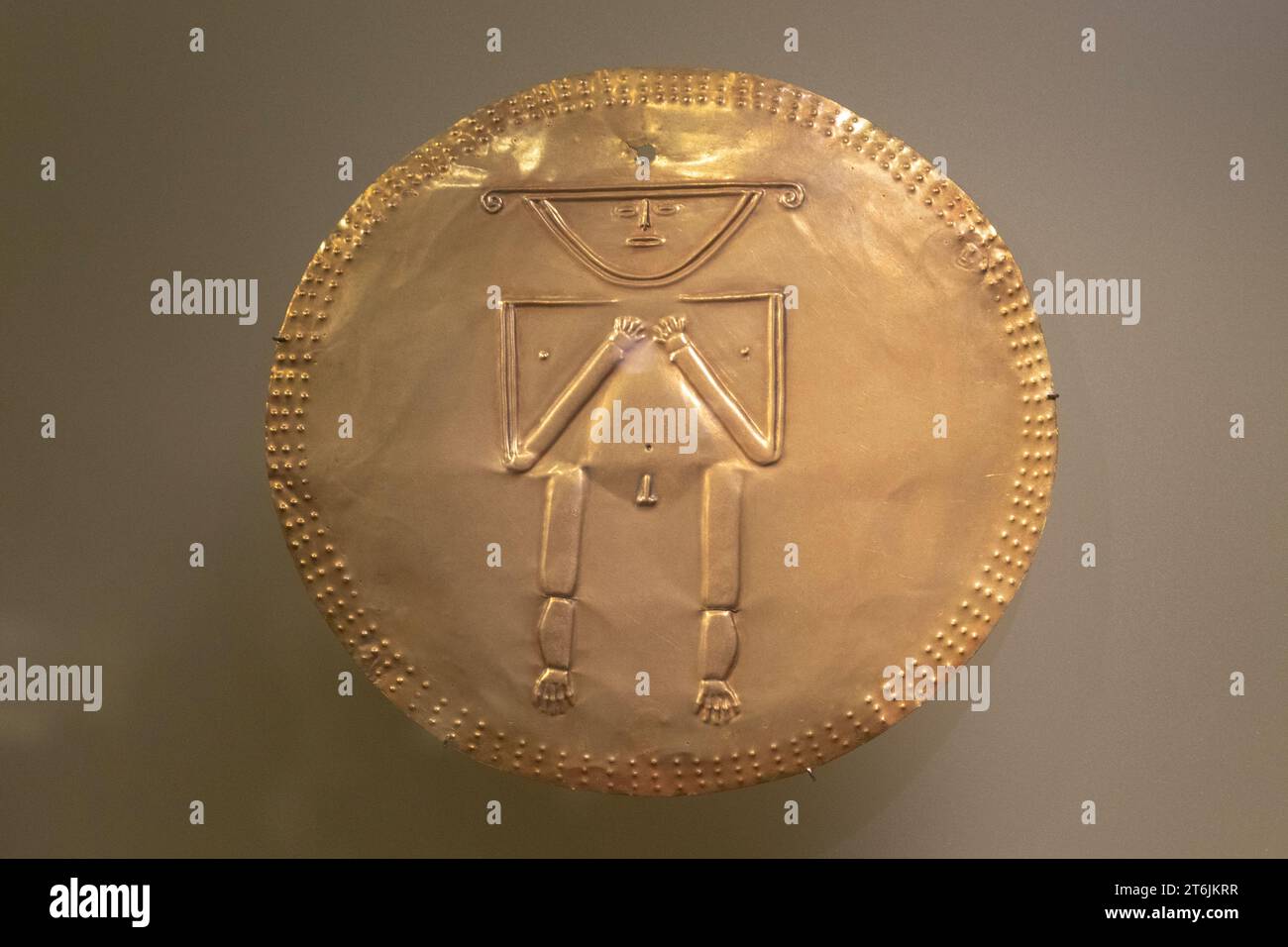 ancient rounded golden pectoral with a man in the middle of pectoral at ...
