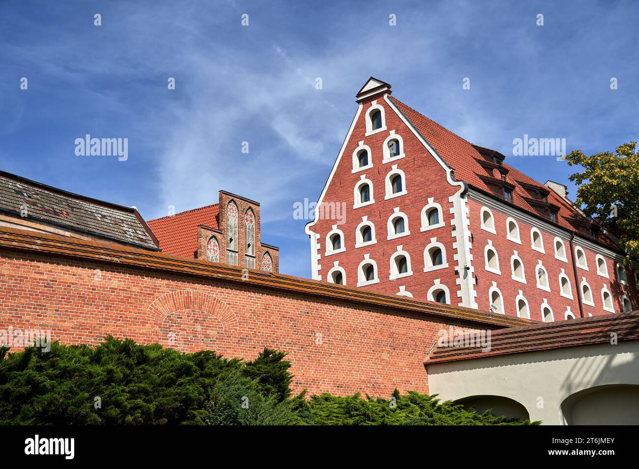 monumental medieval defensive walls and historic brick building in the ...