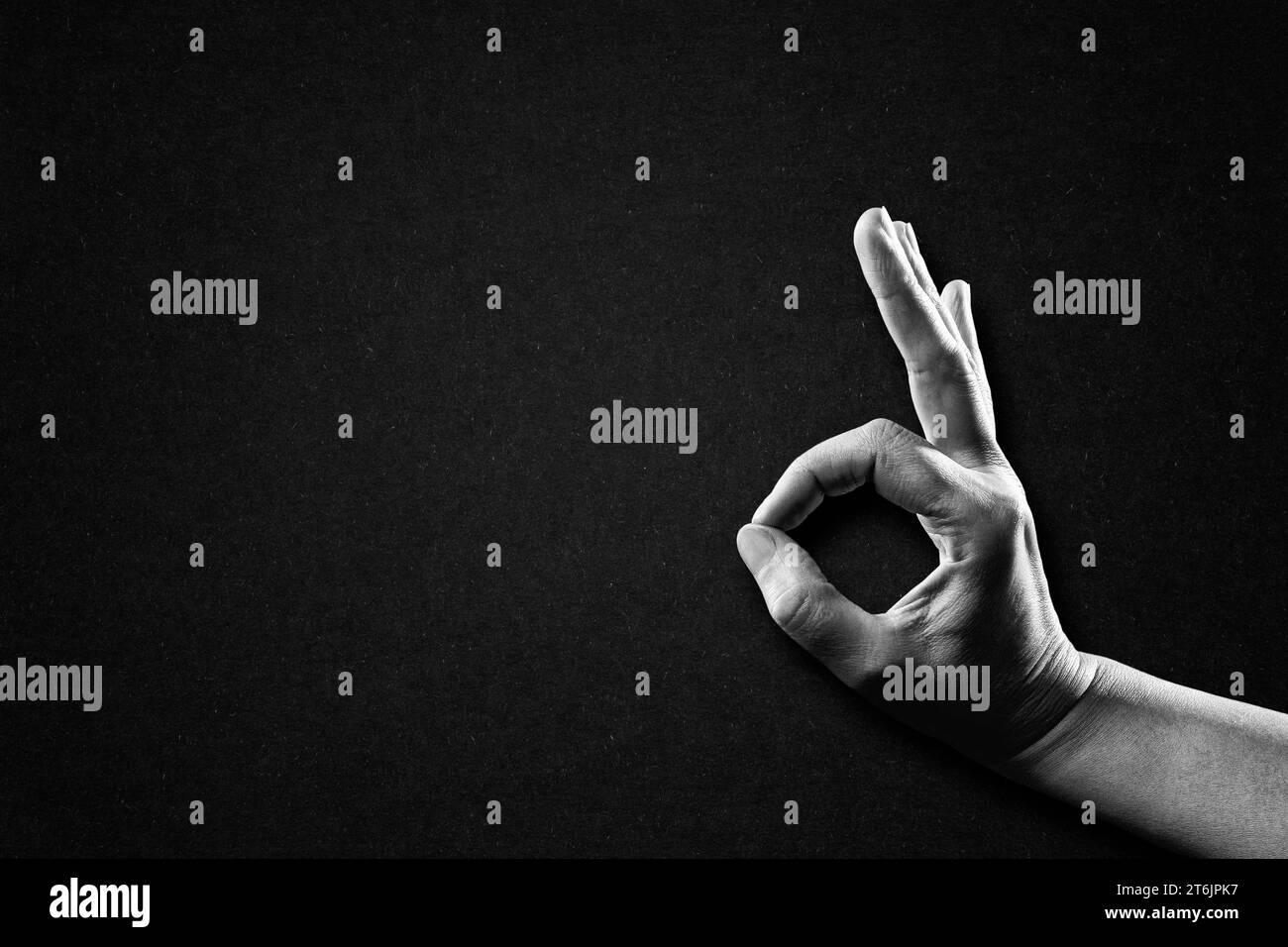 Hand Showing OK Good Sign in Black and White on Textured Paper ...