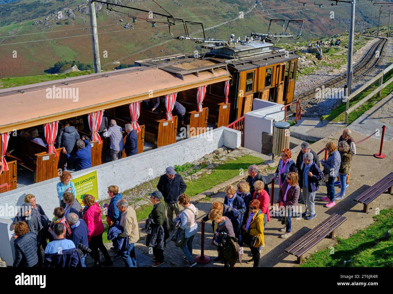 People boarding funicular railway train at the top of La Rhune mountain ...