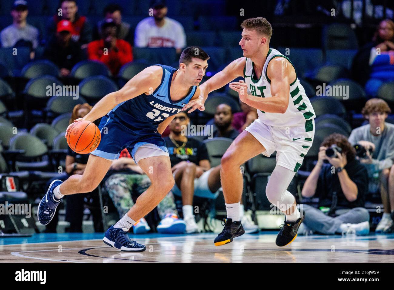 November 10, 2023: Liberty Flames forward Kyle Rode (22) drives on Charlotte 49ers forward Igor ...
