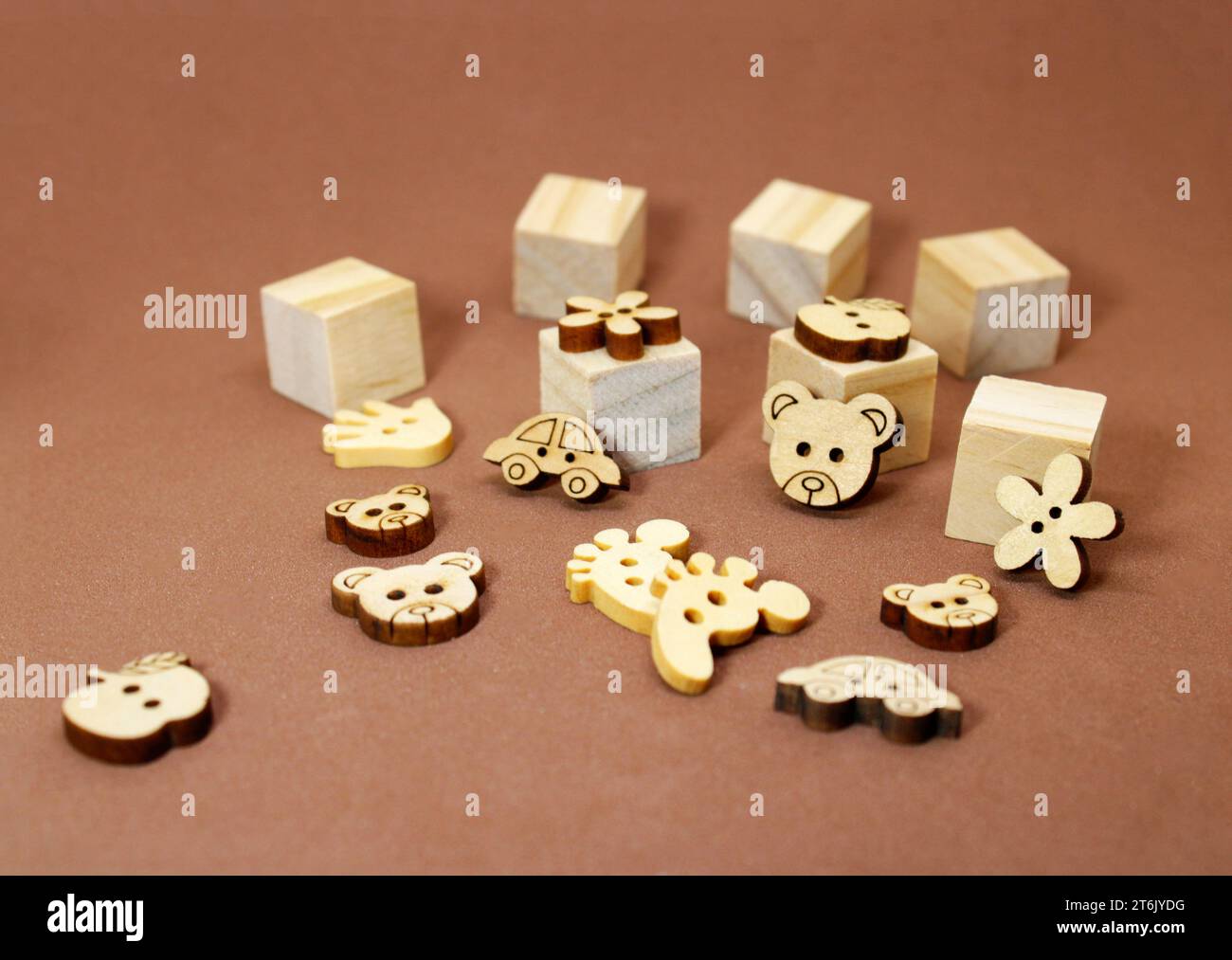Wooden cubes and buttons with different figures Stock Photo - Alamy