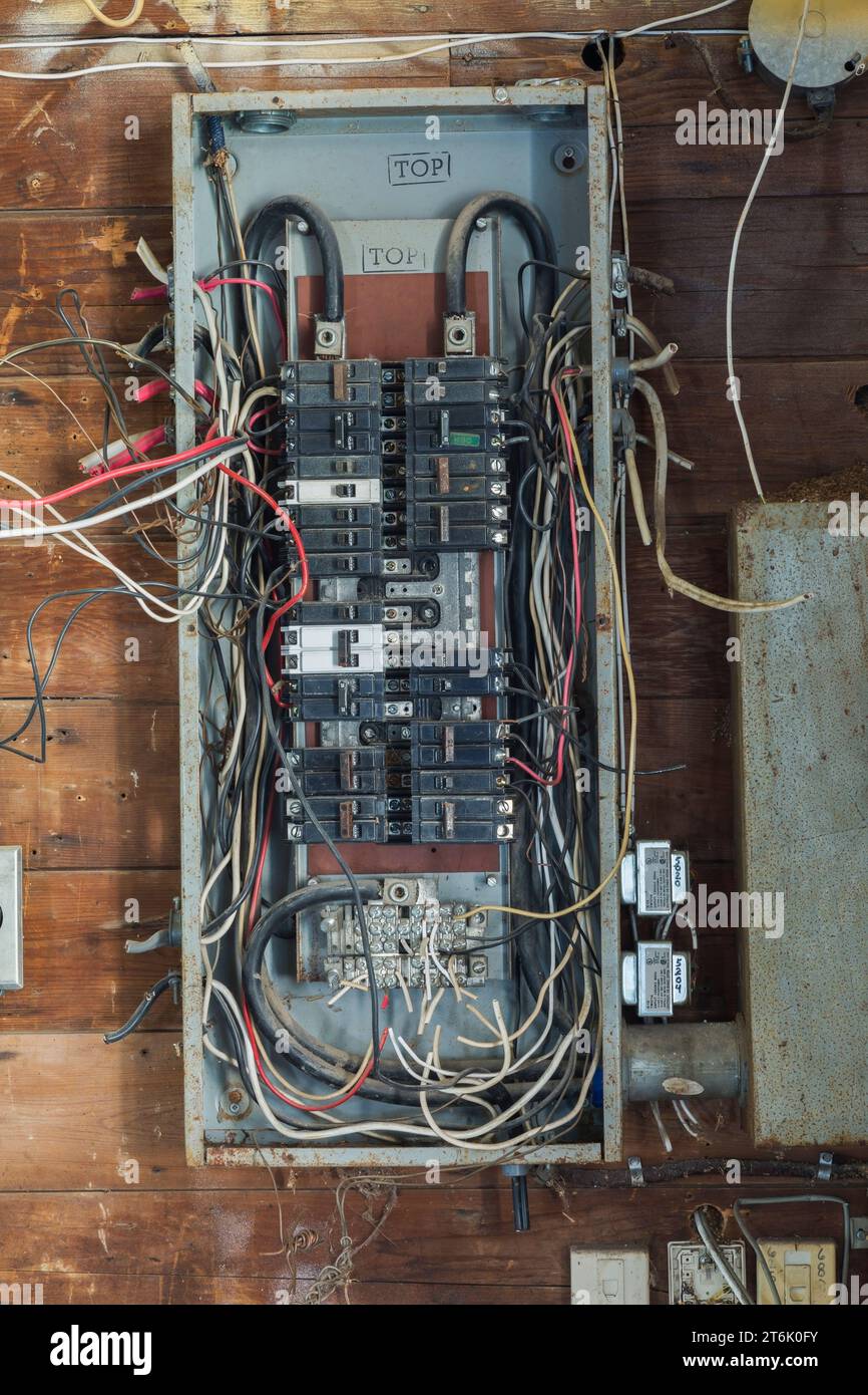 Old electricity distribution panel in abandoned commercial building ...