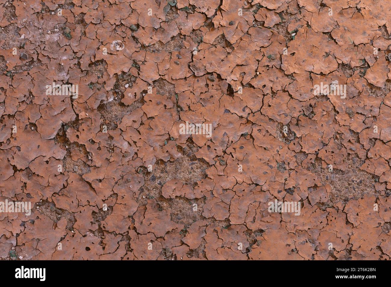 Flaking brownish paint on concrete floor surface Stock Photo - Alamy
