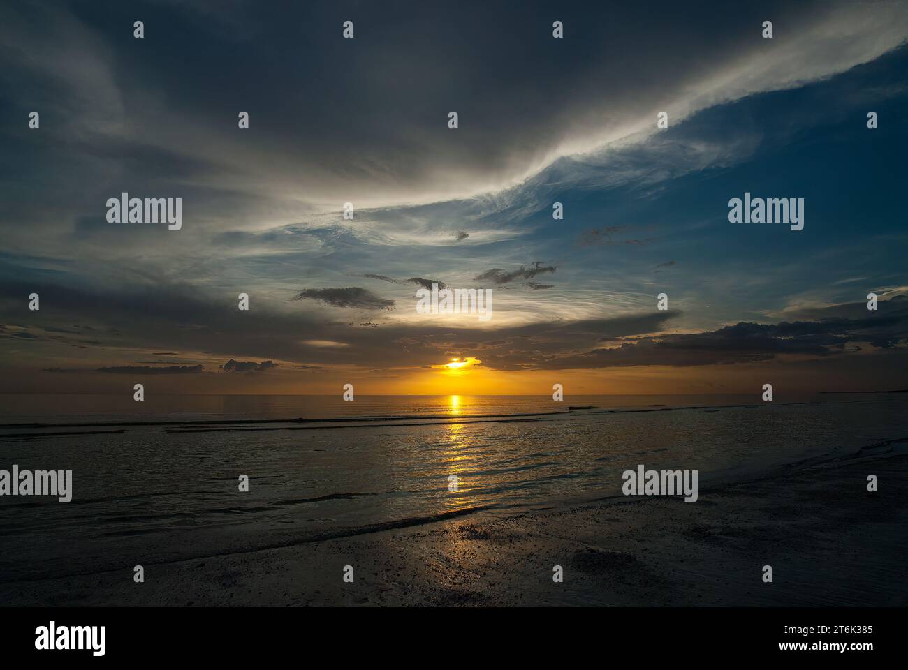 Sunset over the Gulf of Mexico crystal clear and calm waters as the ...