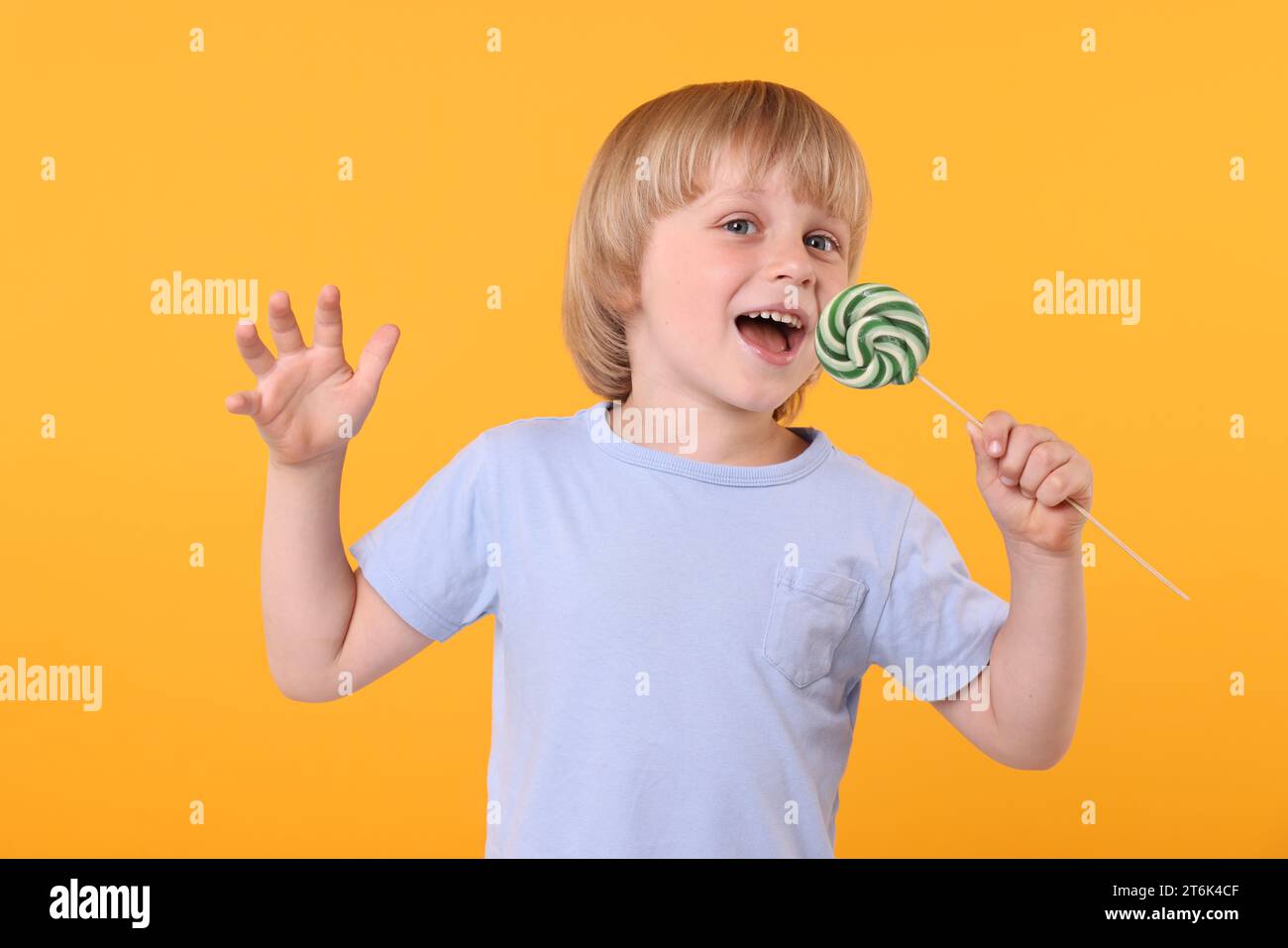Boy eating caramel swirl hi-res stock photography and images - Alamy