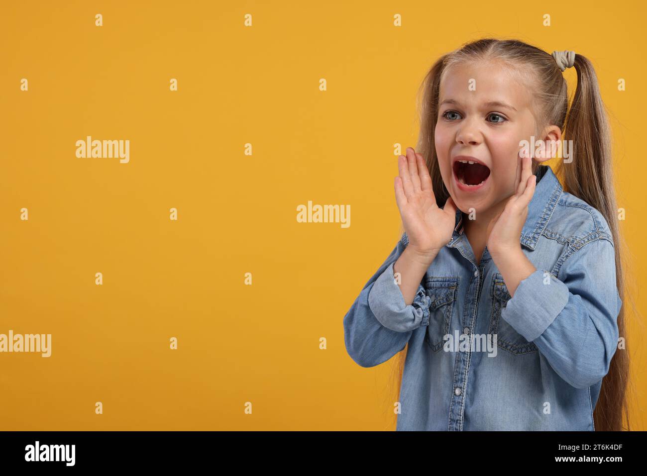 Special promotion. Little girl shouting to announce information on ...