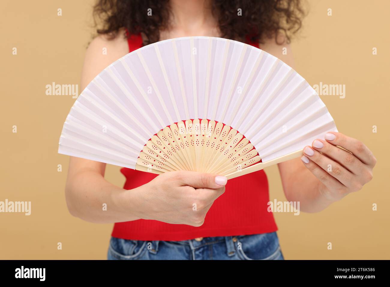 Woman hand fanning in studio hi-res stock photography and images - Alamy