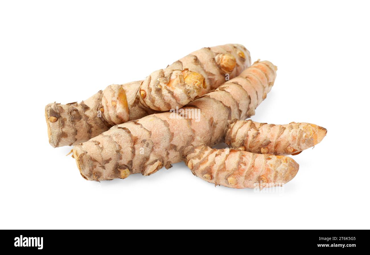 Fresh whole turmeric roots isolated on white Stock Photo - Alamy