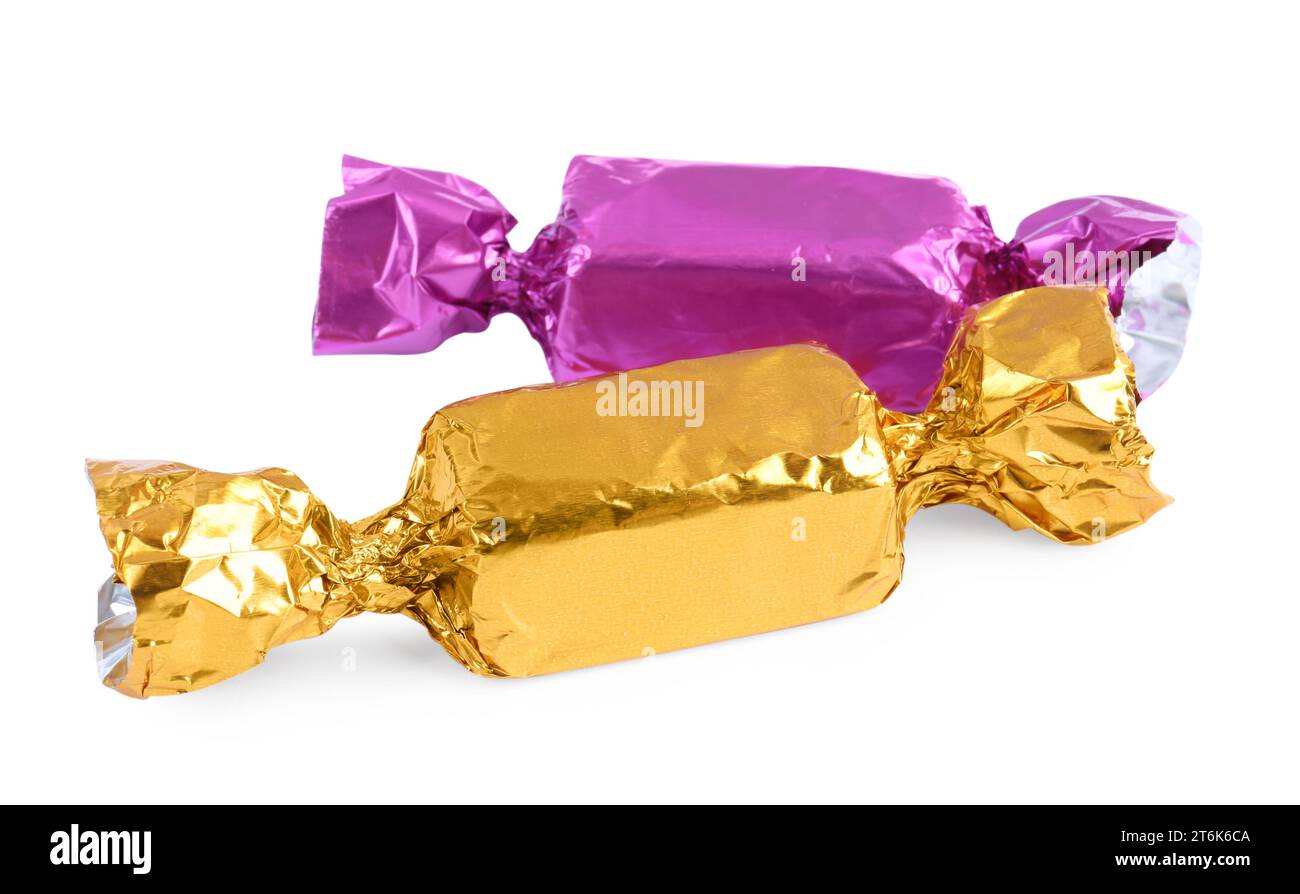 Two candies in colorful wrappers isolated on white Stock Photo - Alamy