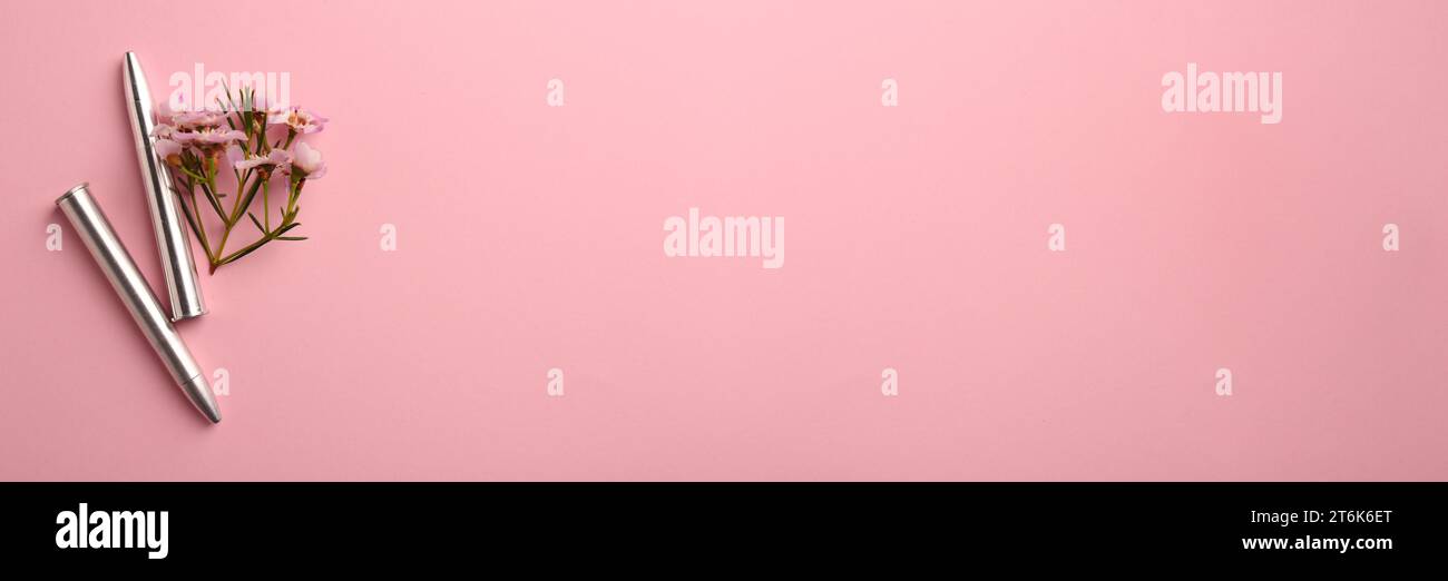 Bullets and beautiful flowers on pink background, flat lay. Banner ...