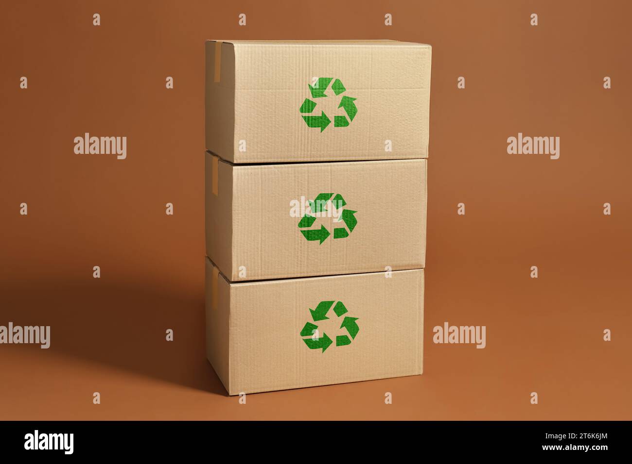 Cardboard boxes with recycle sign stamps on brown background Stock ...