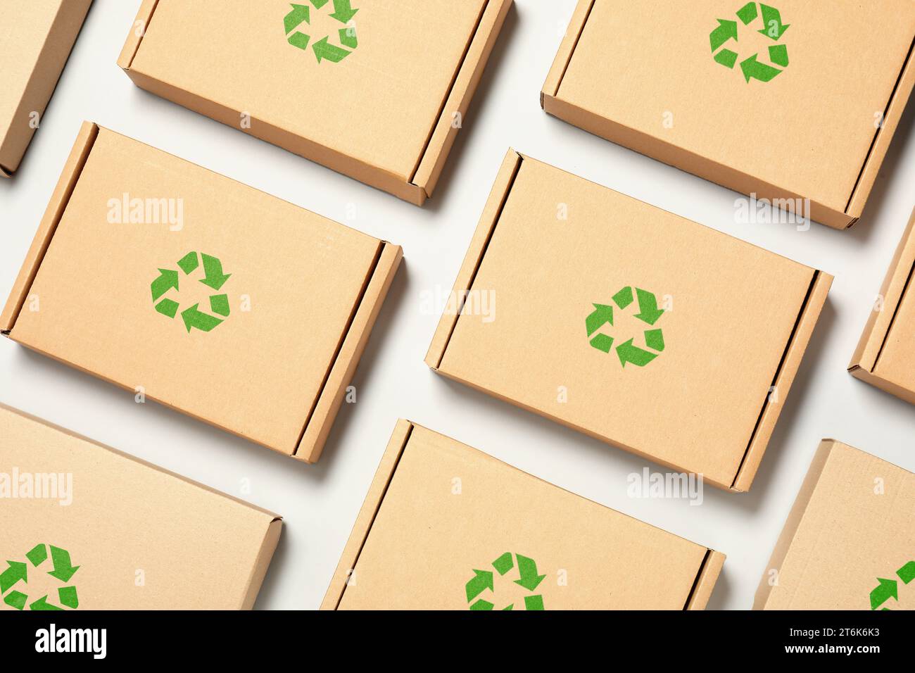 Cardboard boxes with recycle sign stamps on light grey background, flat ...
