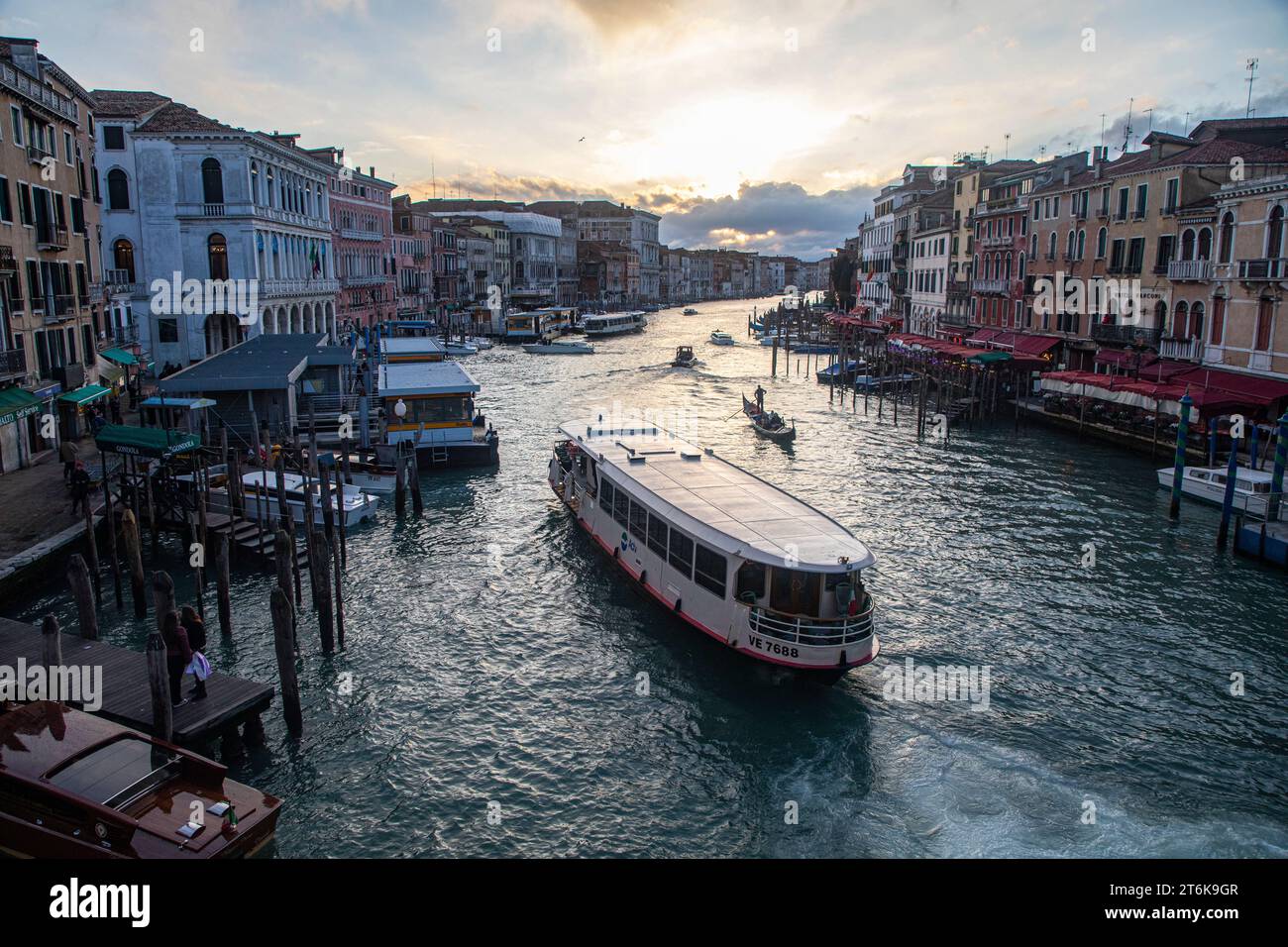 Venice, Italy. Tourists riding in gondola at Grand Canal exploring ...