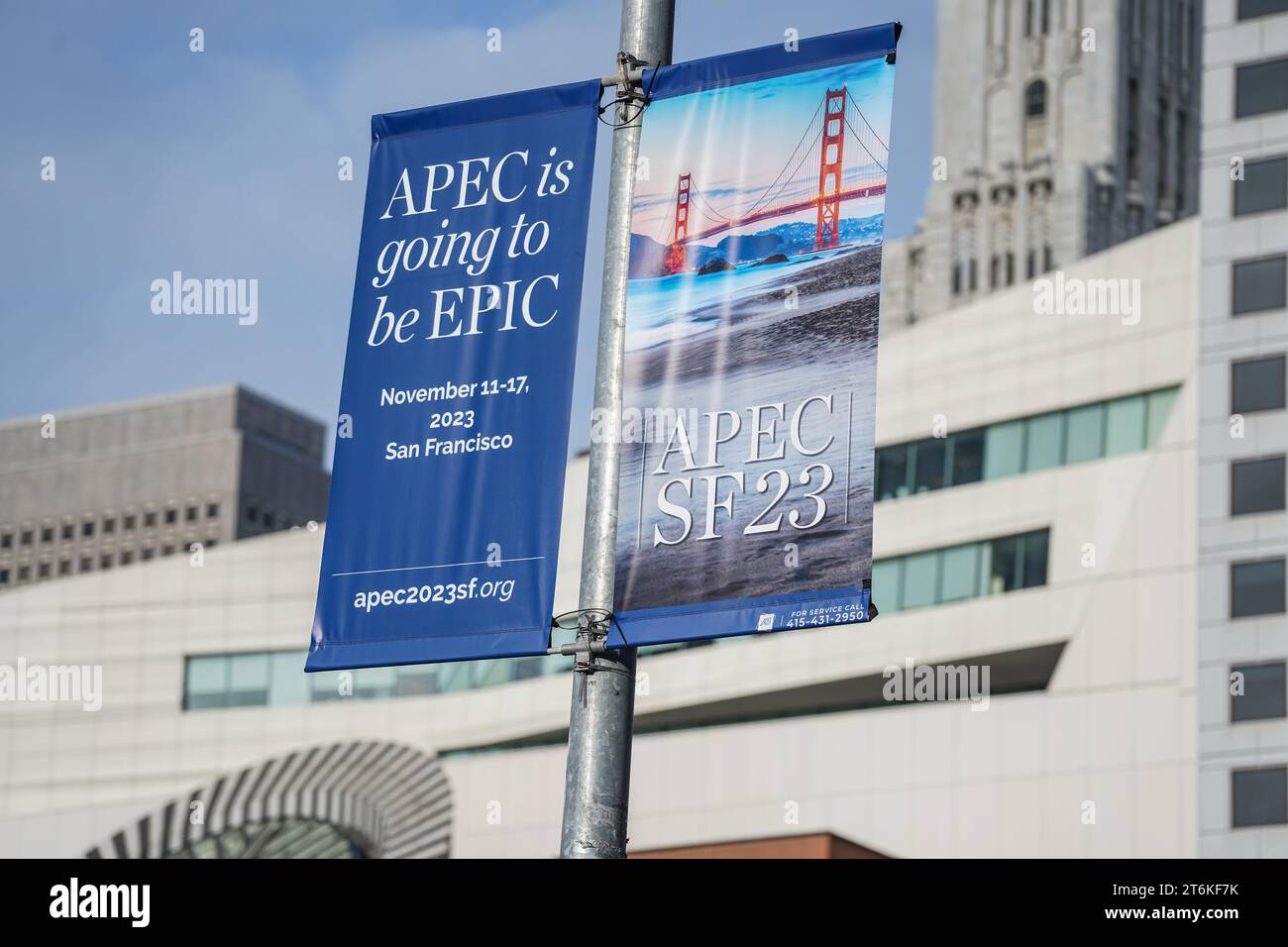 Banners advertising the APEC summit are hang outside the Moscone Center ...