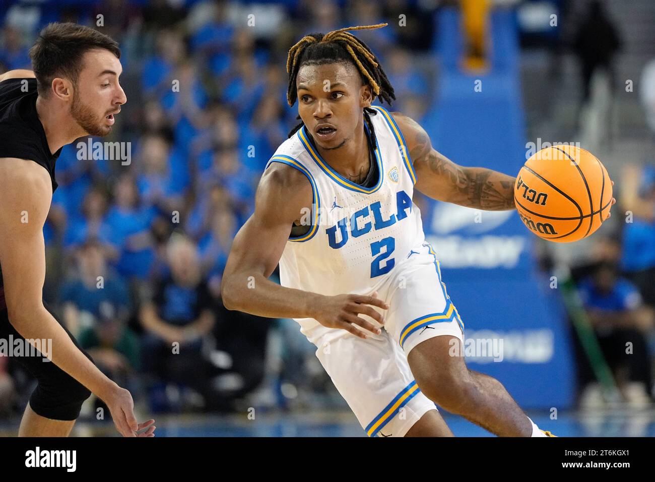 UCLA guard Dylan Andrews, right, drives past Lafayette guard Luka ...