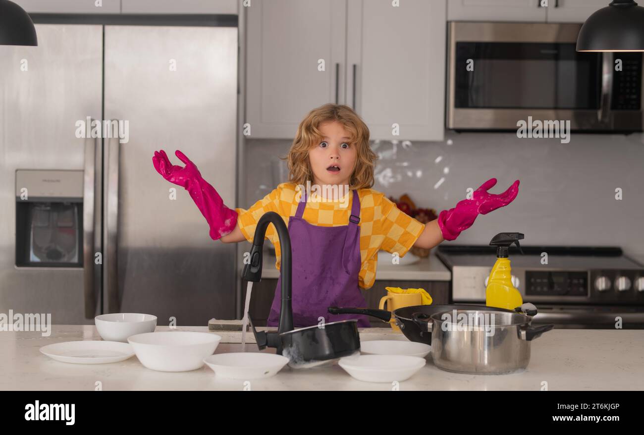 Child doing housework. Little housekeeper. Child washing and wiping ...