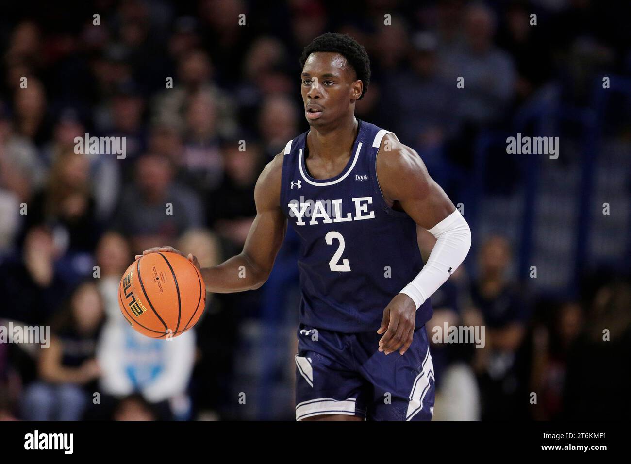 Yale guard Bez Mbeng controls the ball during the first half of an NCAA college basketball game ...