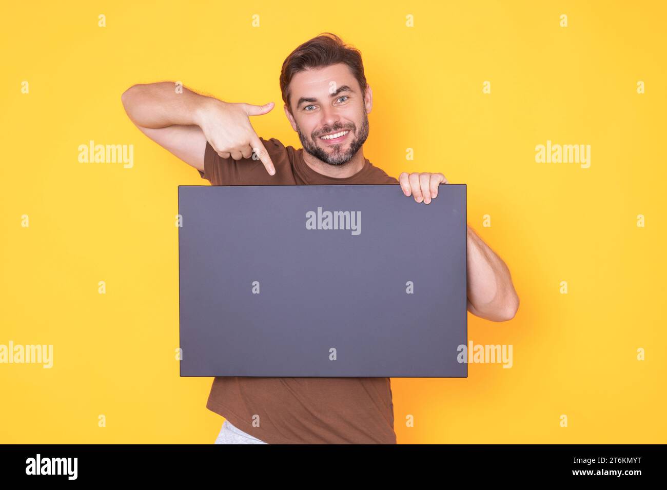 Man Holds Sign With Copy Space Placard Ready For Copy Space Product