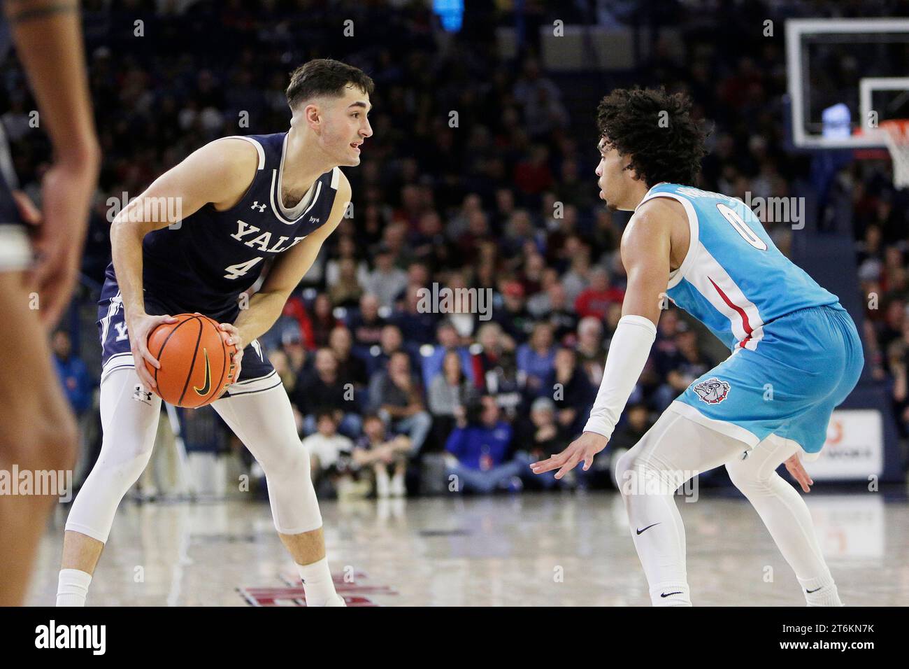 Yale guard John Poulakidas (4) controls the ball while pressured by ...
