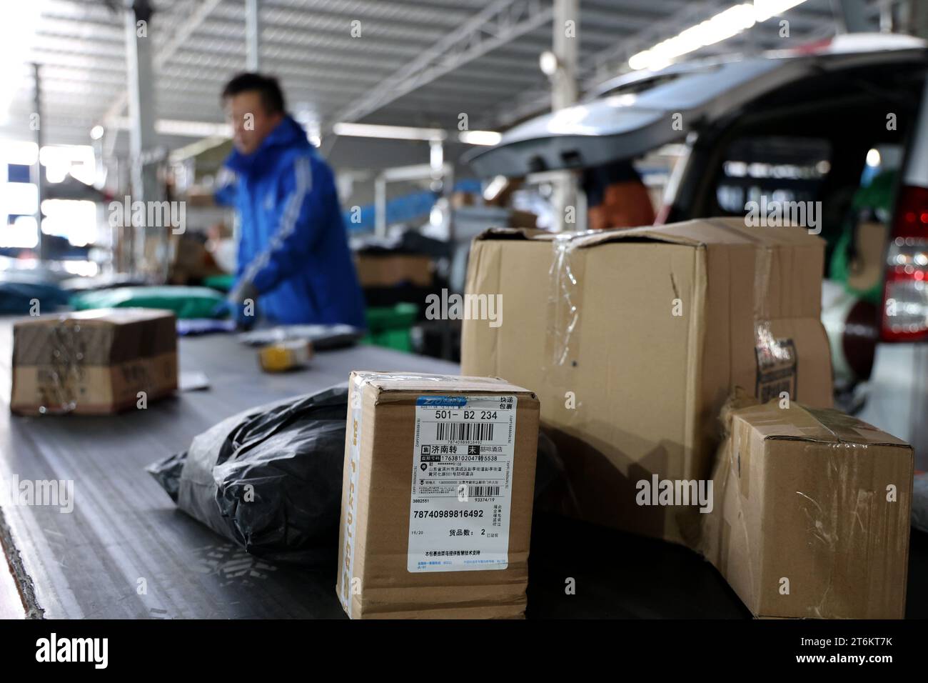 BINZHOU, CHINA - NOVEMBER 11, 2023 - Workers sort express packages at a logistics company in ...