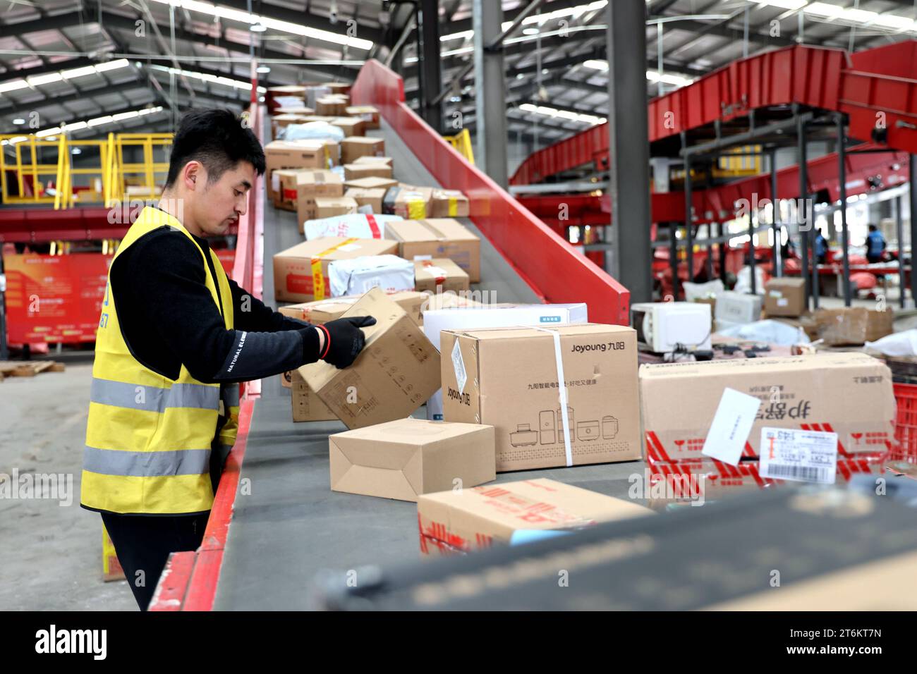 BINZHOU, CHINA - NOVEMBER 11, 2023 - Workers sort express packages at a logistics company in ...