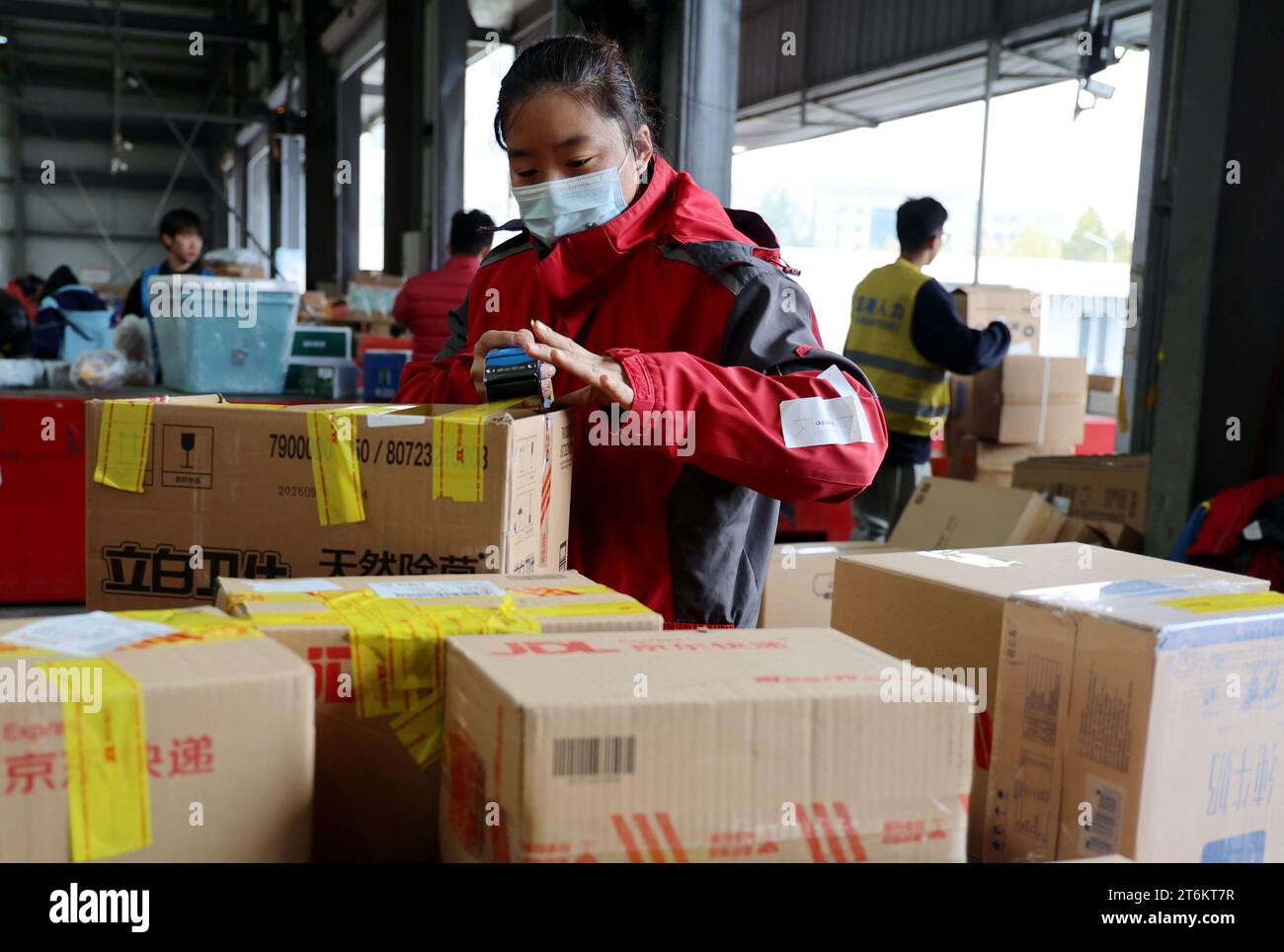BINZHOU, CHINA - NOVEMBER 11, 2023 - Workers sort express packages at a logistics company in ...
