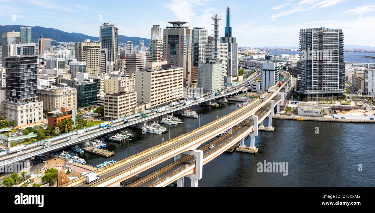 Kobe skyline from above with port and elevated road bridge panorama in ...
