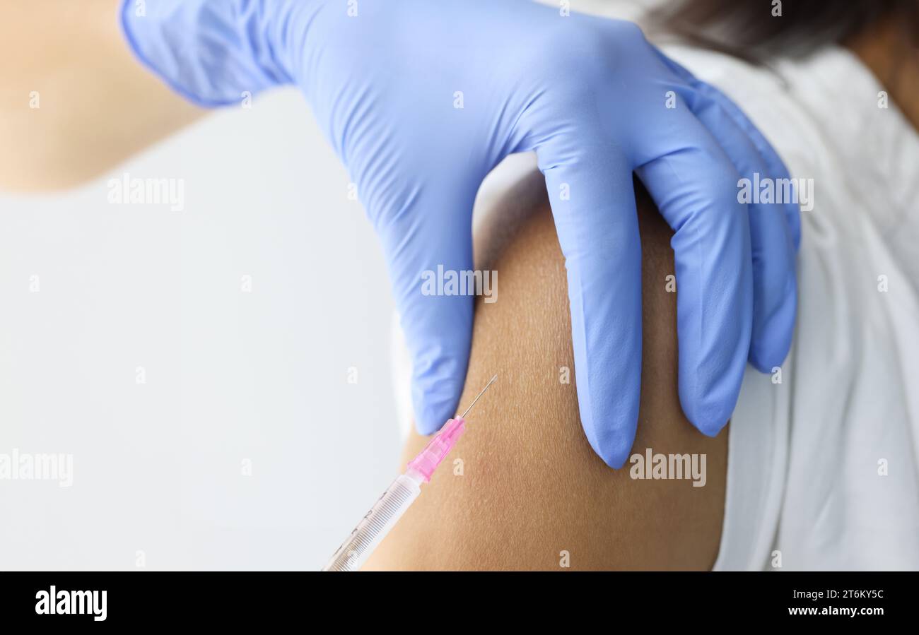 Doctor injecting liquid covid vaccine hi-res stock photography and ...
