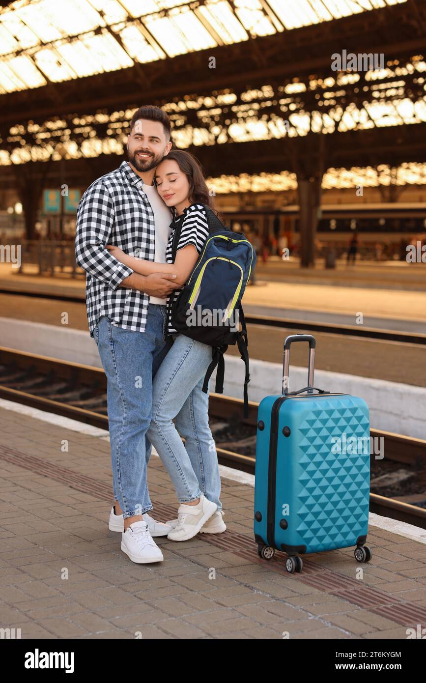 Long-distance relationship. Beautiful couple on platform of railway ...