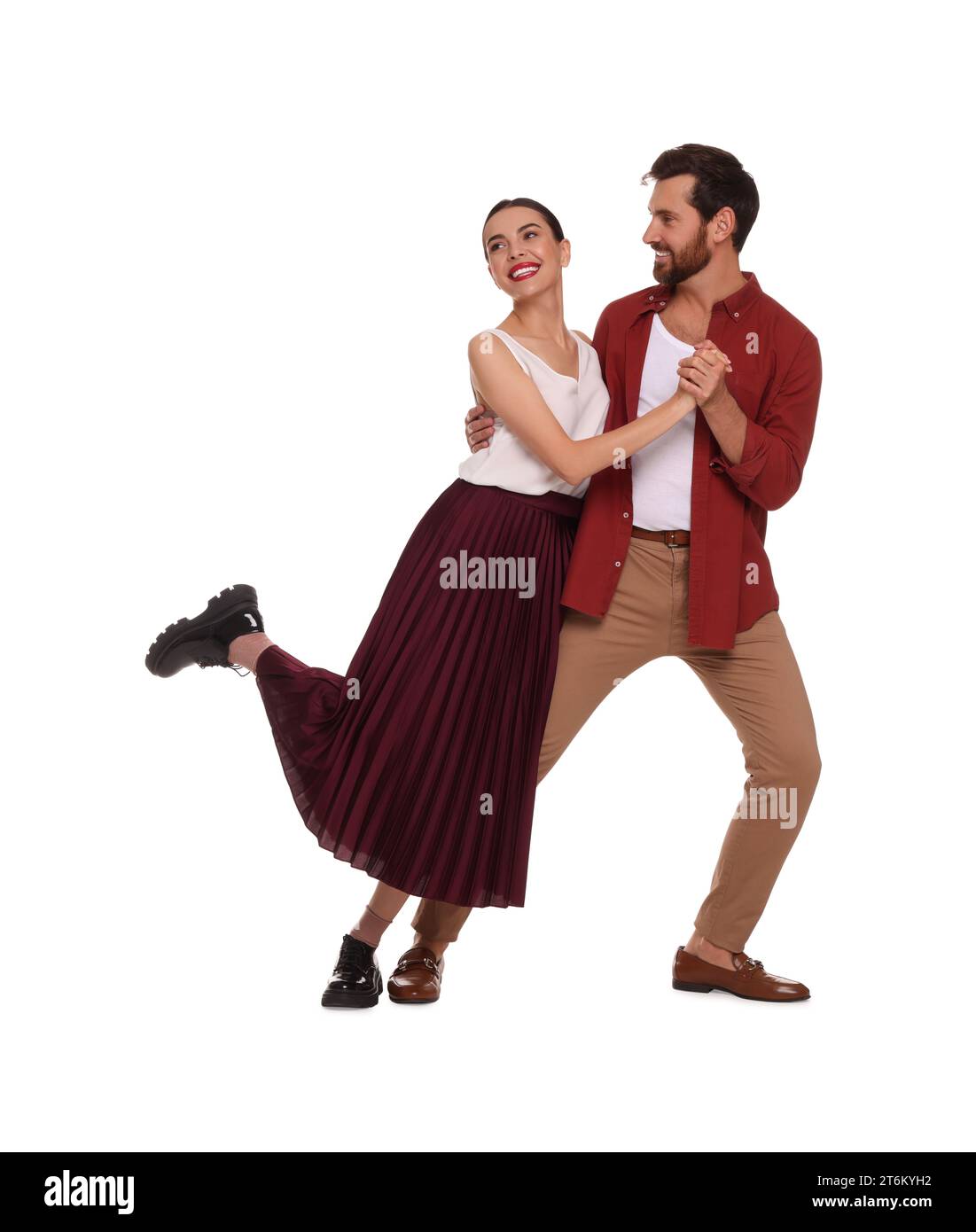 Happy couple dancing together on white background Stock Photo - Alamy