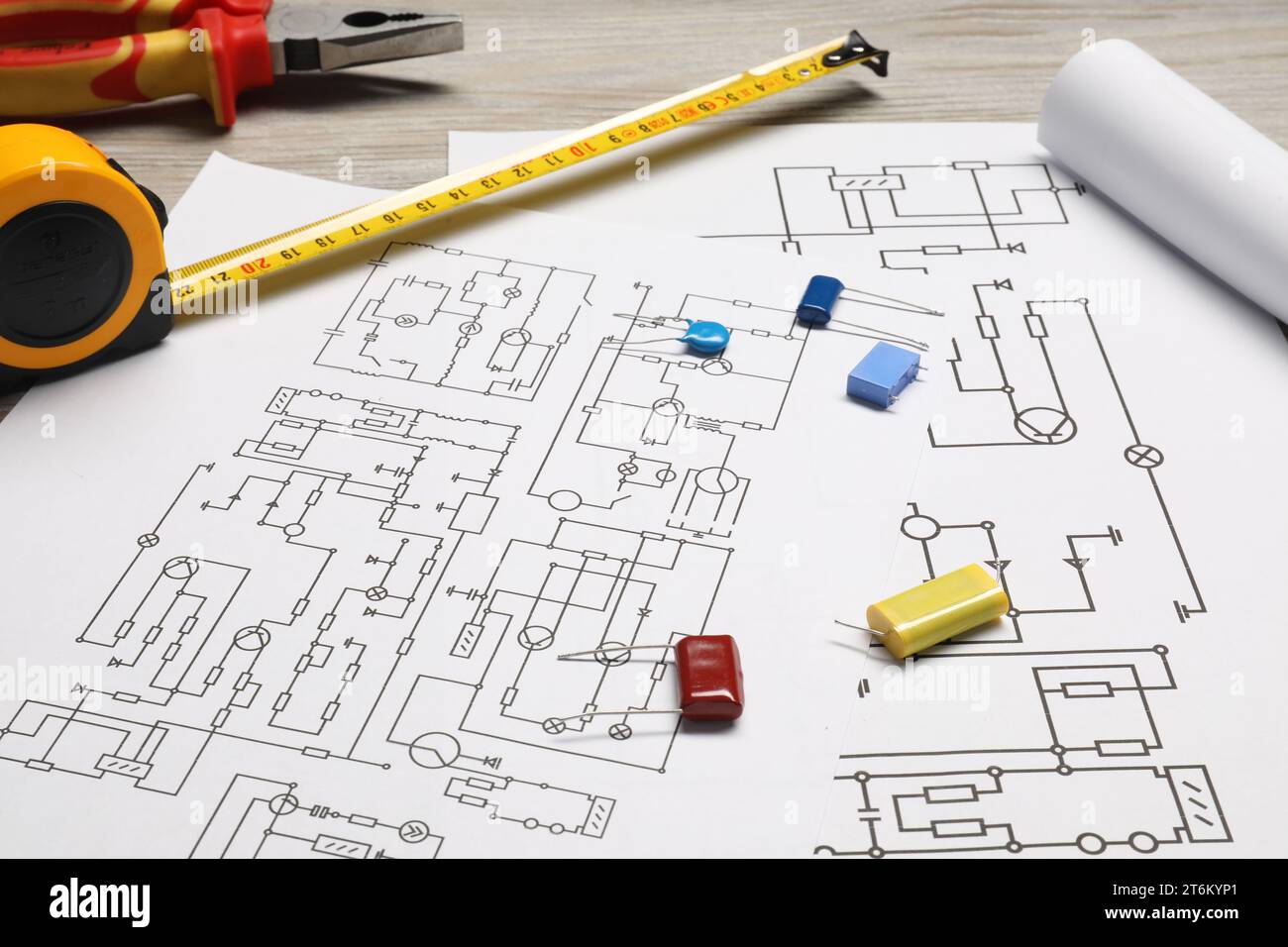 Wiring diagrams and tools on white table, closeup Stock Photo - Alamy