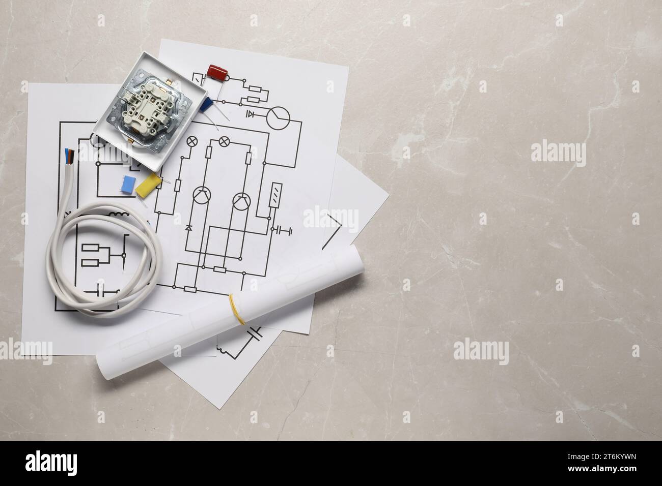 Wiring diagrams, wires and disassembled light switch on table, flat lay ...
