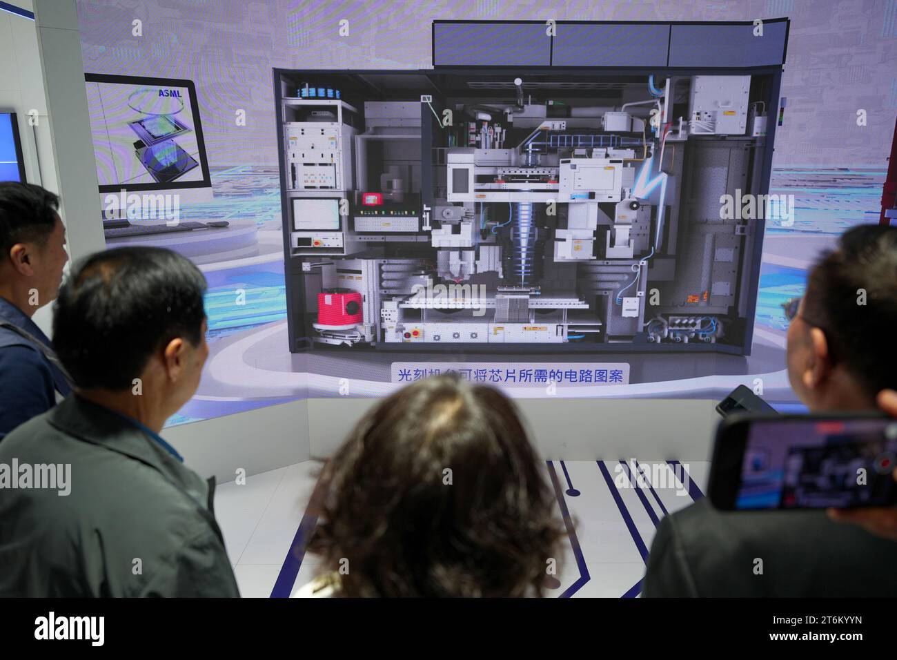 SHANGHAI, CHINA - NOVEMBER 8, 2023 - Visitors learn about lithography machines at the booth of ...