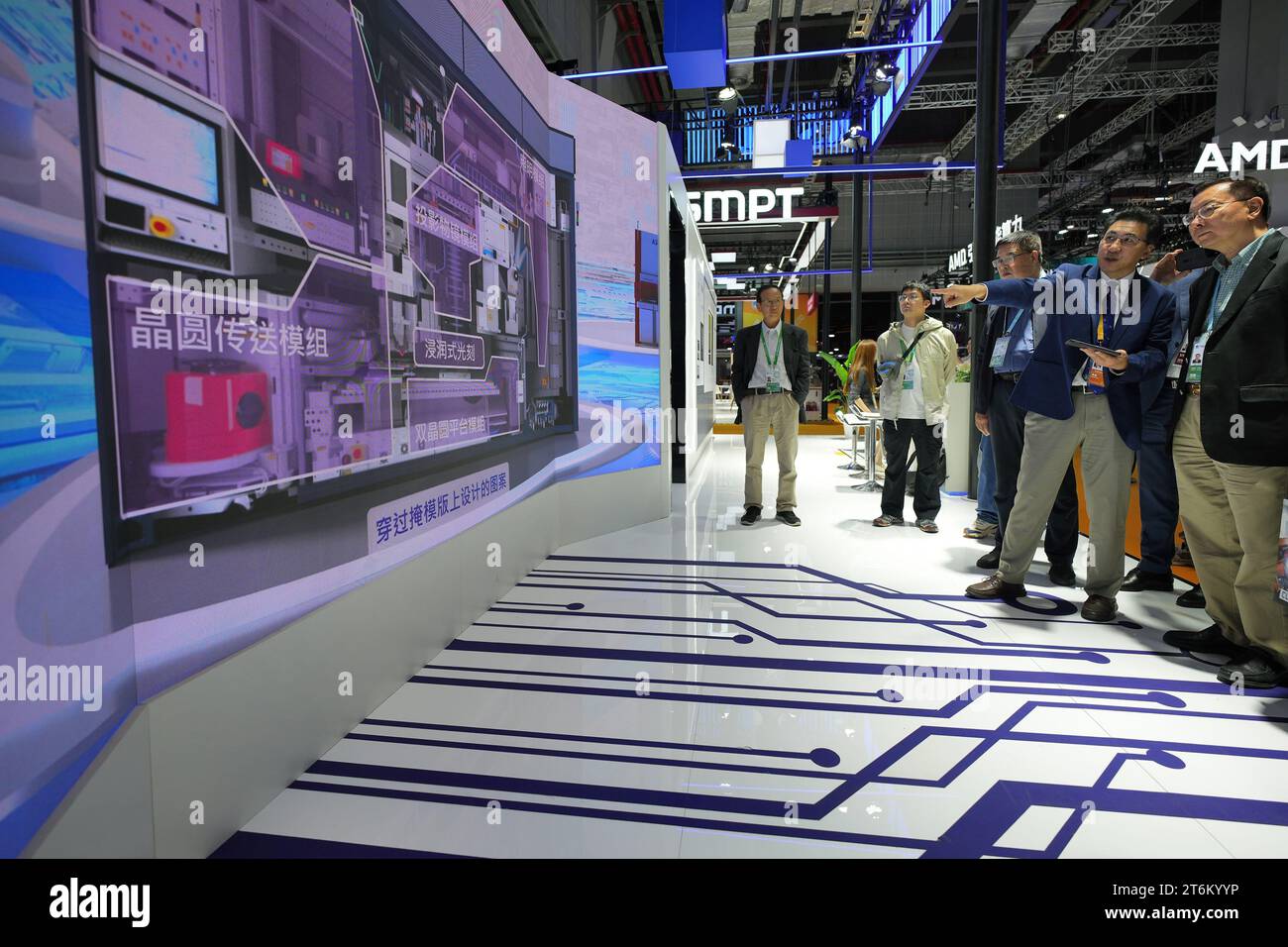 SHANGHAI, CHINA - NOVEMBER 8, 2023 - Visitors learn about lithography machines at the booth of ...