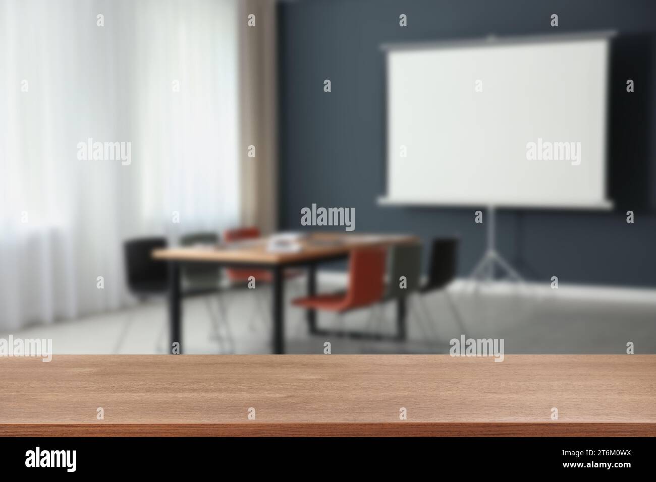 Empty wooden table in comfortable office. Space for design Stock Photo ...