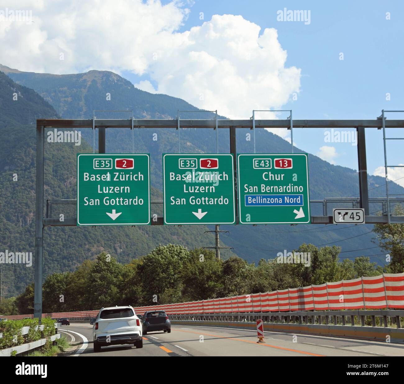 road signs on the motorway with directions to many locations in ...